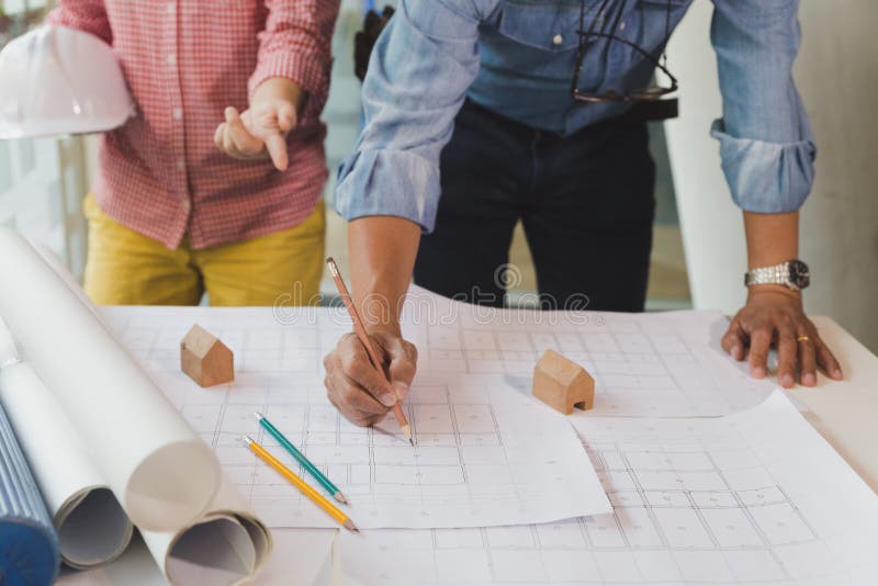 Architect or Engineer Meeting, Working with Blueprints in Office Stock ...