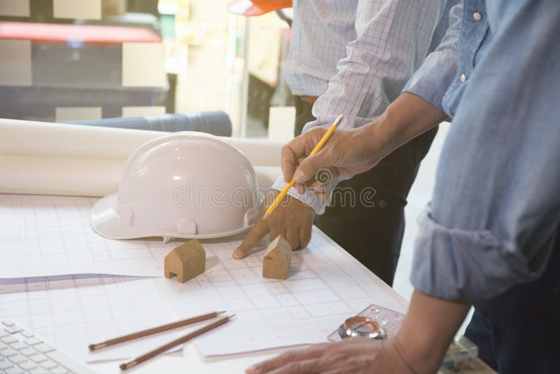 Architect or Engineer Meeting, Working with Blueprints in Office Stock ...