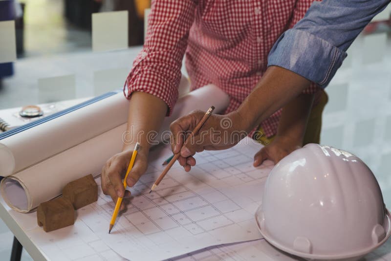 Architect or Engineer Meeting, Working with Blueprints in Office Stock ...