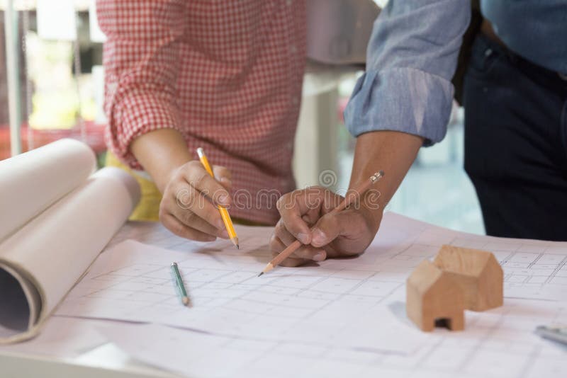 Architect or Engineer Meeting, Working with Blueprints in Office Stock ...