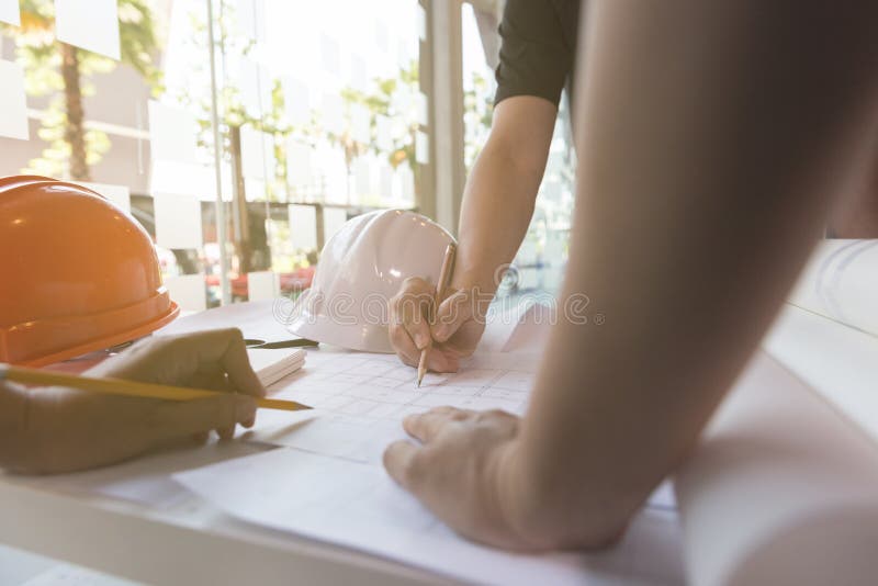 Architect or Engineer Meeting, Working with Blueprints in Office Stock ...