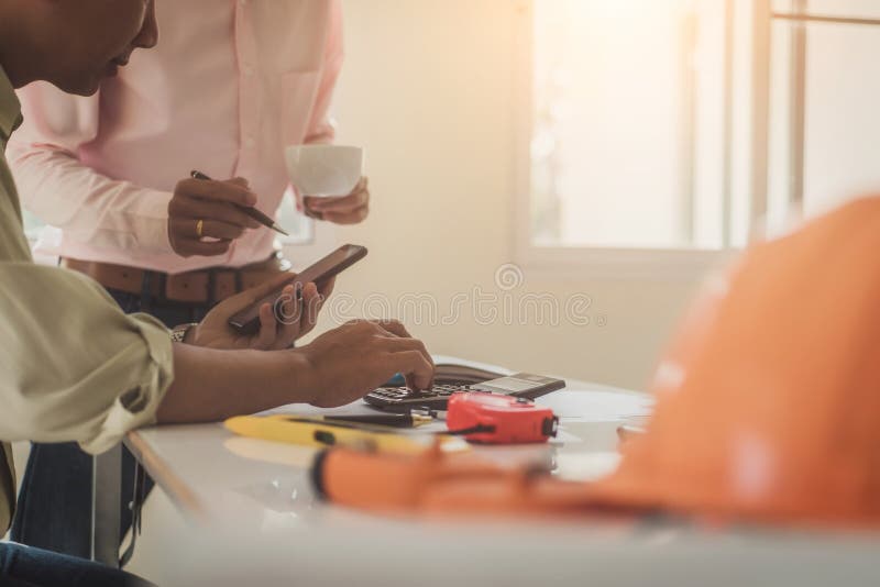 Architect or Engineer Reading Message on Phone during the Meeting ...