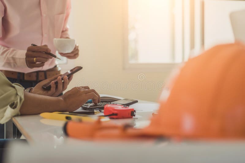 Architect or Engineer Reading Message on Phone during the Meeting ...
