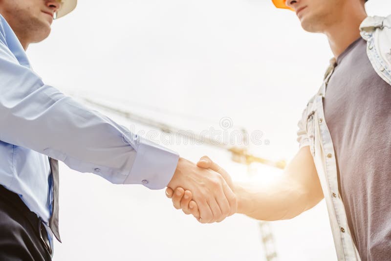 Architect Engineer Shaking Hands Other Hand at Construction Site. Business Teamwork, Cooperation ...