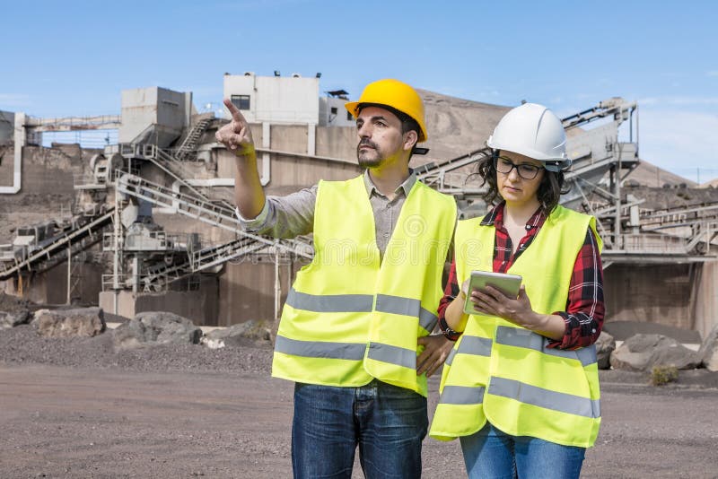 Architect and Engineer with Tablet Examining Construction Site Stock ...