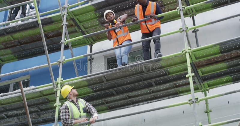 Architect, Engineer and Talking on Scaffolding for Building, Teamwork ...