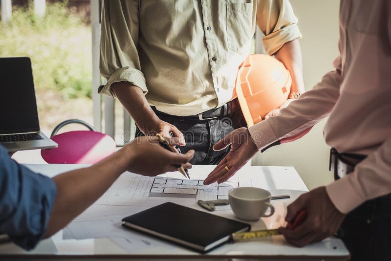 Architect or Engineer Team Working with Blueprints Building Plan Design ...