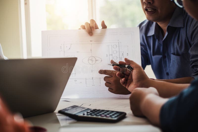 Architect or Engineer Team Working with Blueprints Building Plan Design ...