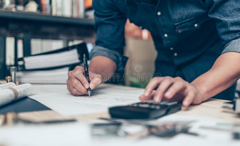 Architect Engineer Use Calculator for Calculate Drawing Design Working ...