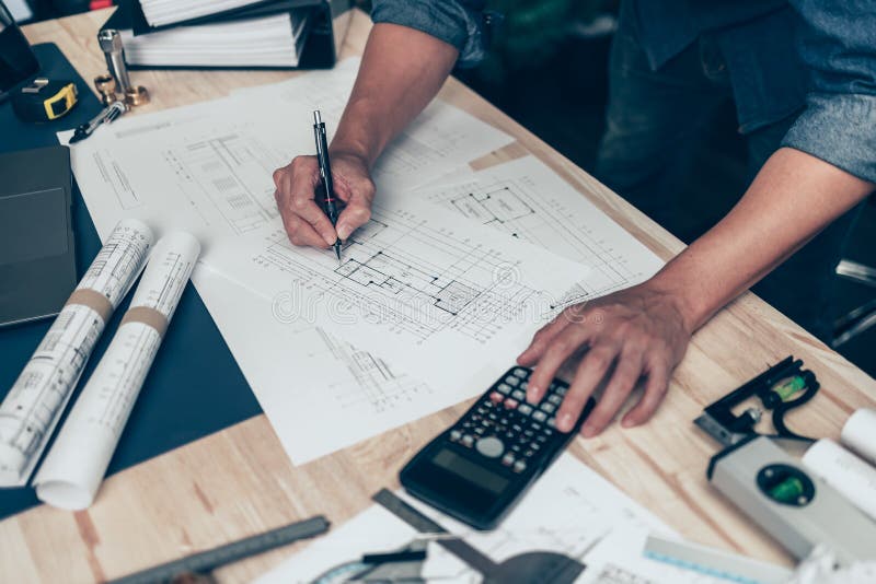 Architect Engineer Use Calculator for Calculate Drawing Design Working ...