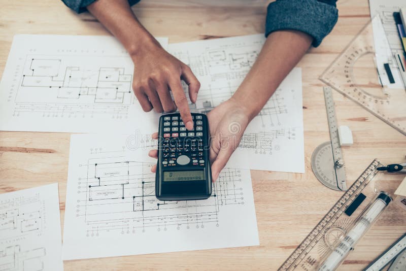 Architect Engineer Use Calculator for Calculate Drawing Design Working ...