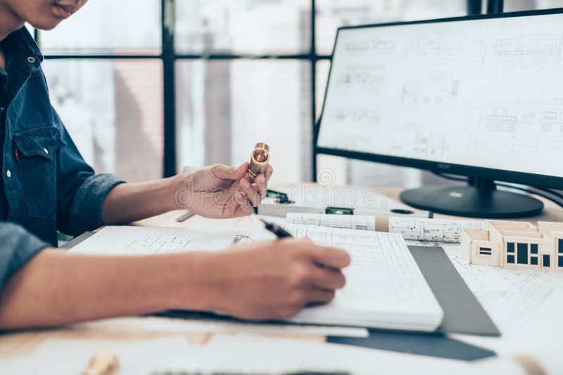 Architect Engineer Use Pen Drawing Design Working on Blueprint and Holding Joint Pipe. House ...