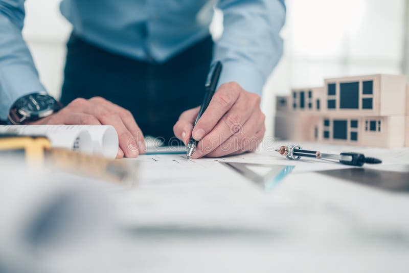 Architect Engineer Use Pen Drawing Design Working on Blueprint. House Planning Design and ...