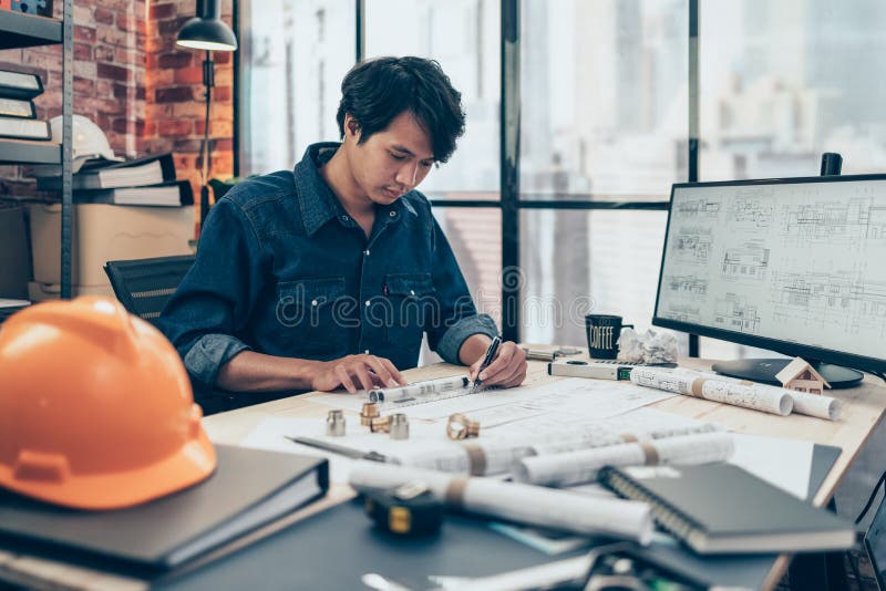 Architect Engineer Use Pen and Mini T-slide Drawing Design Working on Blueprint. House Planning ...