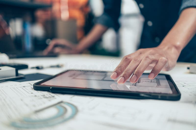 Architect Engineer Use Tablet To Read Drawing Design. House Planning ...