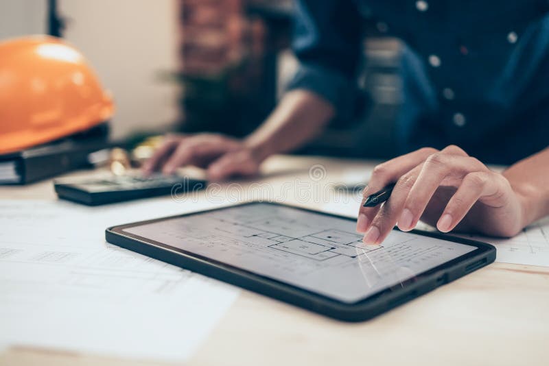 Architect Engineer Use Tablet To Read Drawing Design. House Planning ...