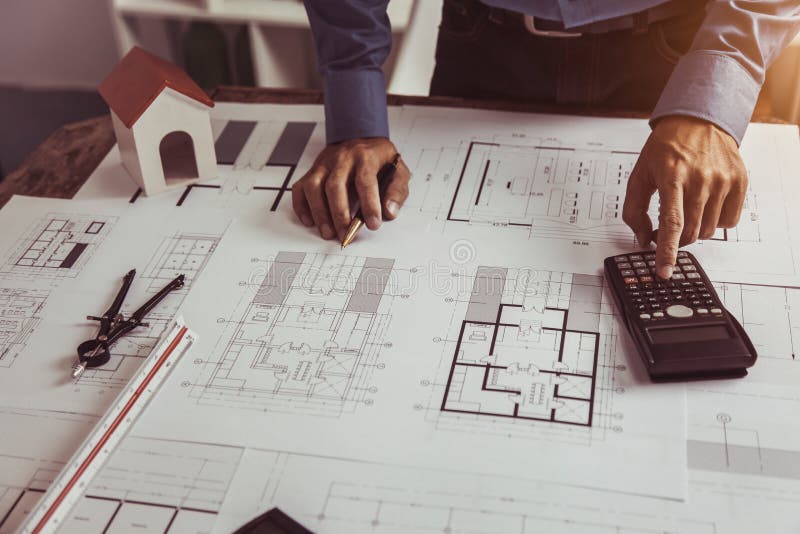 Architect Engineer Using Calculator Estimate Construction Drawings with ...