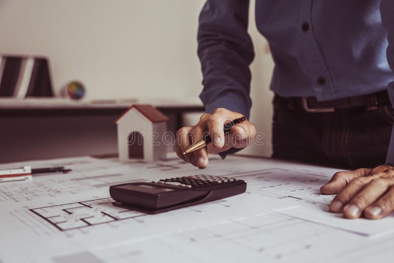 Architect Engineer Using Calculator Estimate Construction Drawings with ...