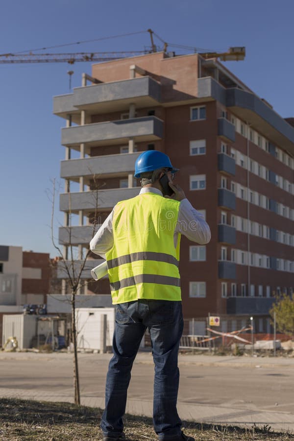 Architect or Engineer Using Mobile Phone on the Construction Site ...
