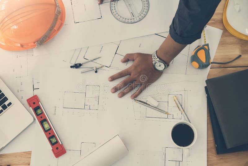 Architect or Engineer Using Pencil and Protractor Working on Blueprint ...