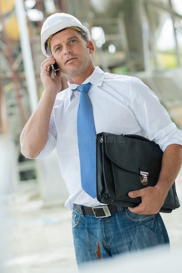 Architect or Engineer Using Phone in Site Stock Photo - Image of build ...