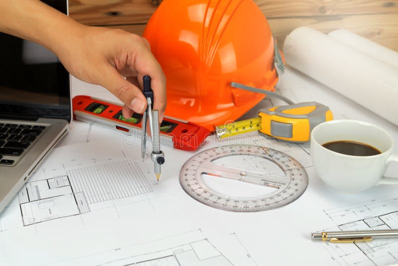 An Architect or Engineer Working on Blueprint, an Architect or Engineer ...