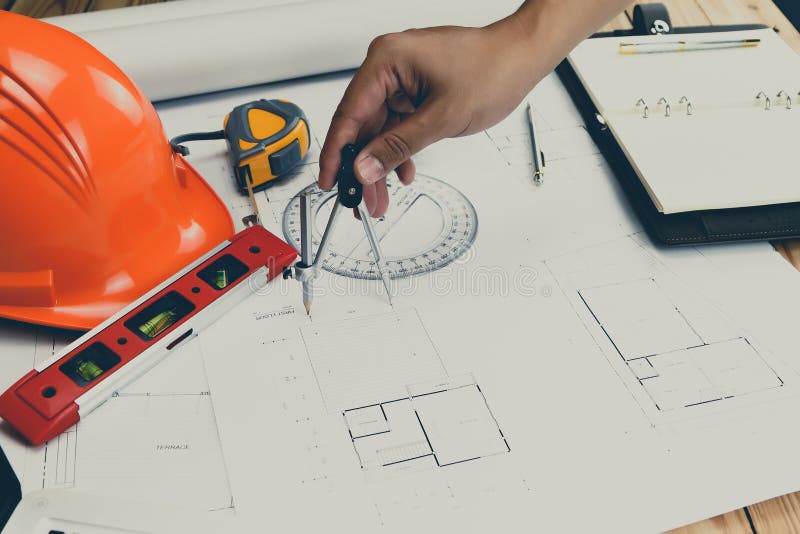 An Architect or Engineer Working on Blueprint, an Architect or Engineer ...