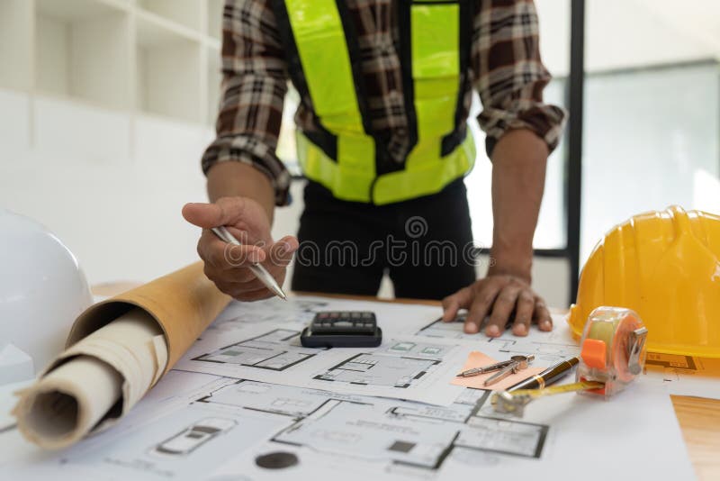 Architect or Engineer Working with Blueprints for Architectural Plan ...