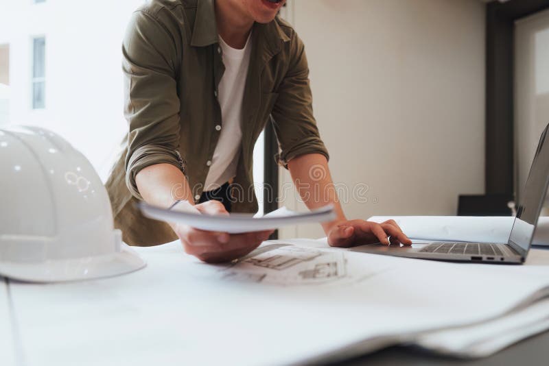 Architect or Engineer Working with Blueprints for Architectural Plan ...