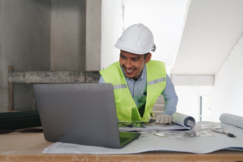 Architect or Engineer Working with Blueprints for Architectural Plan ...