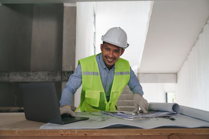 Architect or Engineer Working with Blueprints for Architectural Plan ...