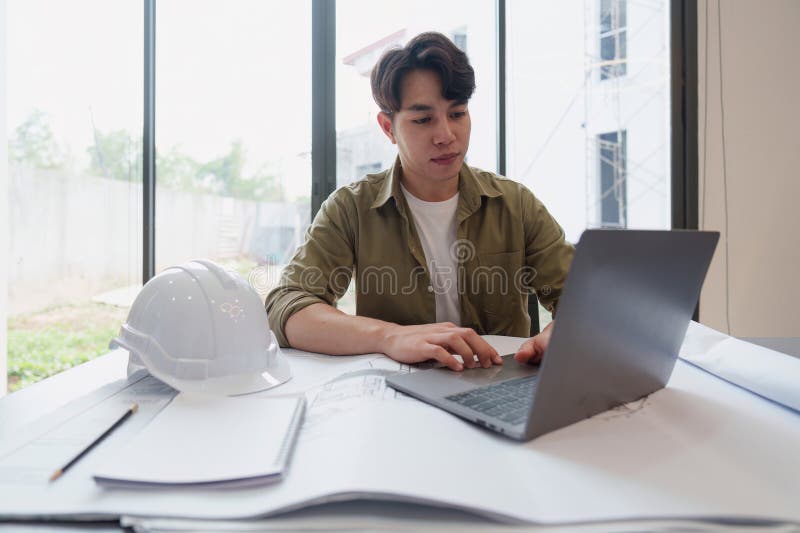 Architect or Engineer Working with Blueprints for Architectural Plan ...