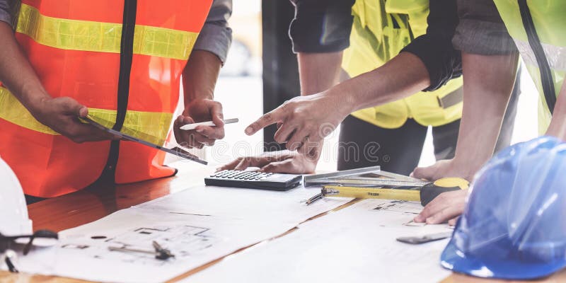 Architect and Engineer Working with Blueprints for Architectural Plan ...