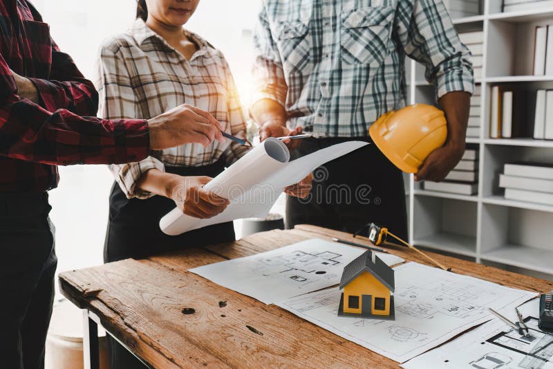 Architect and Engineer Working with Blueprints for Architectural Plan ...