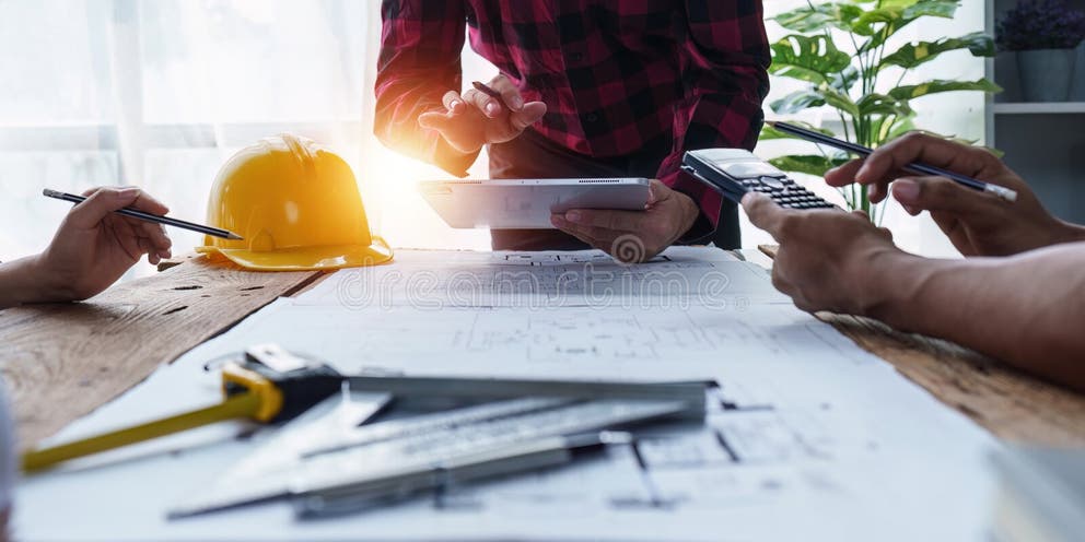 Architect and Engineer Working with Blueprints for Architectural Plan ...