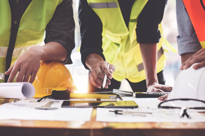 Architect and Engineer Working with Blueprints for Architectural Plan ...