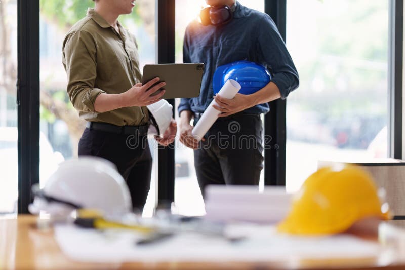 Architect and Engineer Working with Blueprints for Architectural Plan ...