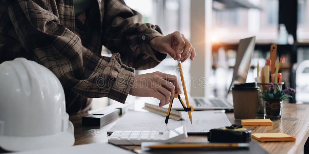 Architect or Engineer Working with Compasses and Blueprints for ...