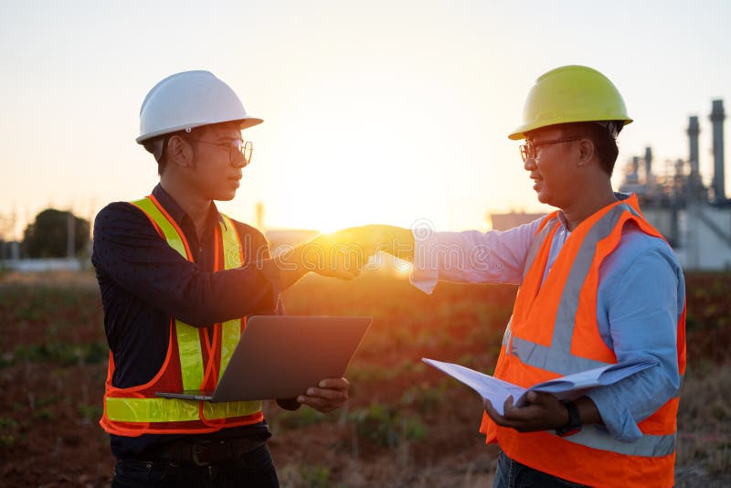 Architect and Engineer Working at the Construction Site and Discussion ...