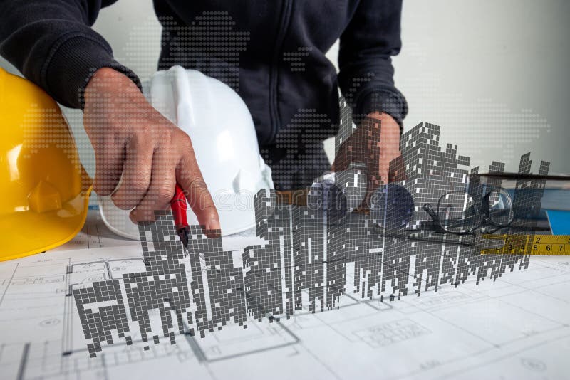 An Architect or Engineer is Working on a Desk with Architectural and ...