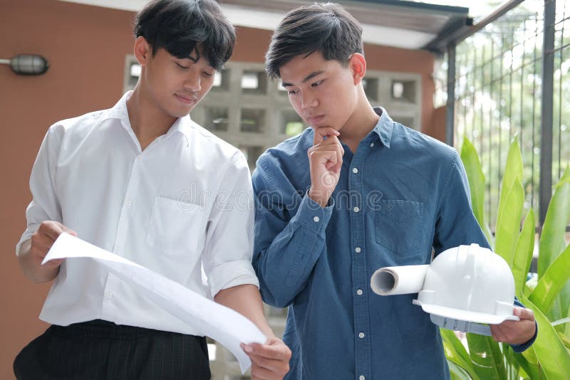 Architect Engineer Working on House Blueprint of Real Estate Project ...