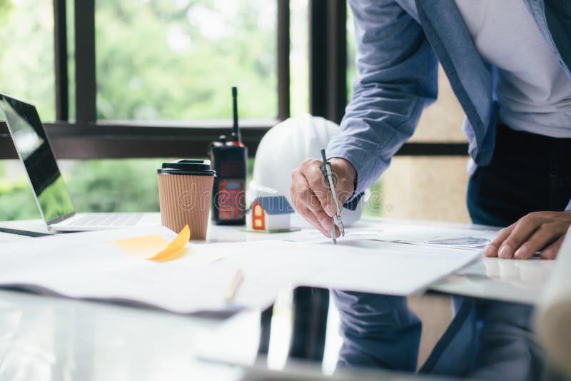 Architect or Engineer Working in Office Stock Image - Image of holding ...