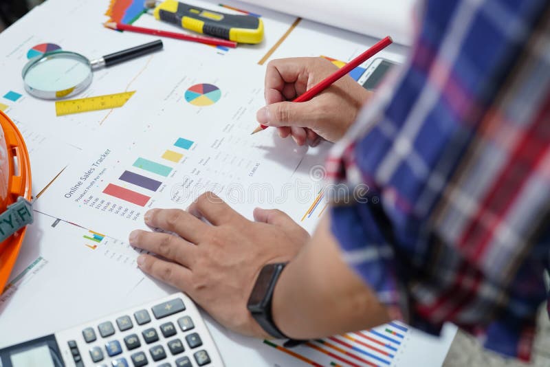 Architect or Engineer Working Project Accounting with Graph Stock Image ...
