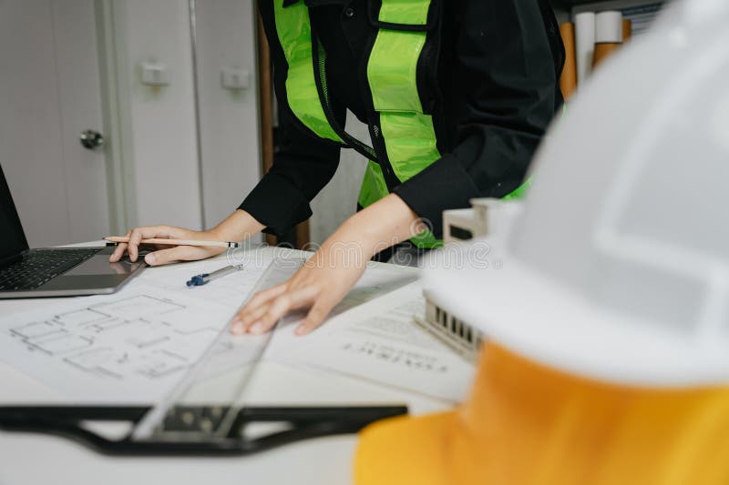 Architect or Engineer Working on Table Use Drawing Tool on the Paper ...