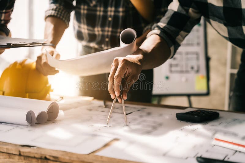 Architect or Engineer Working on Table Use Drawing Tool on the Paper ...