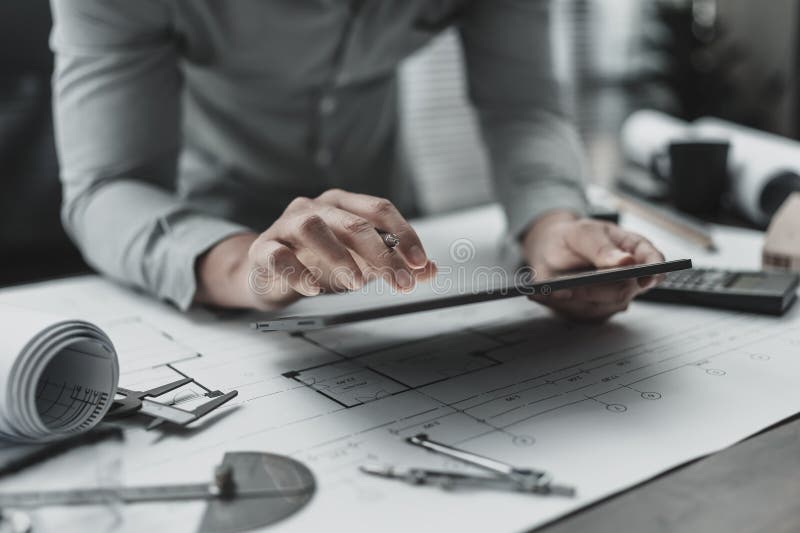 Architect, Engineering Working with House Drawings Inspection on Tablet ...