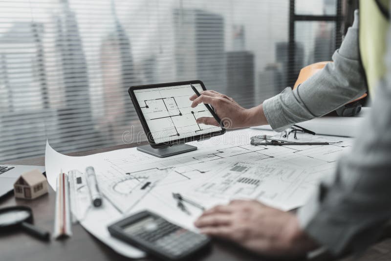 Architect, Engineering Working with House Drawings Inspection on Tablet ...