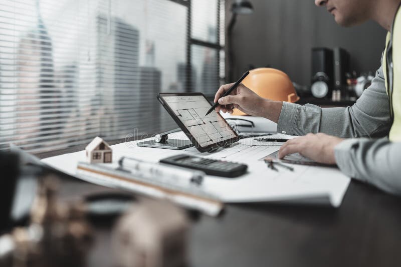 Architect, Engineering Working with House Drawings Inspection on Tablet ...