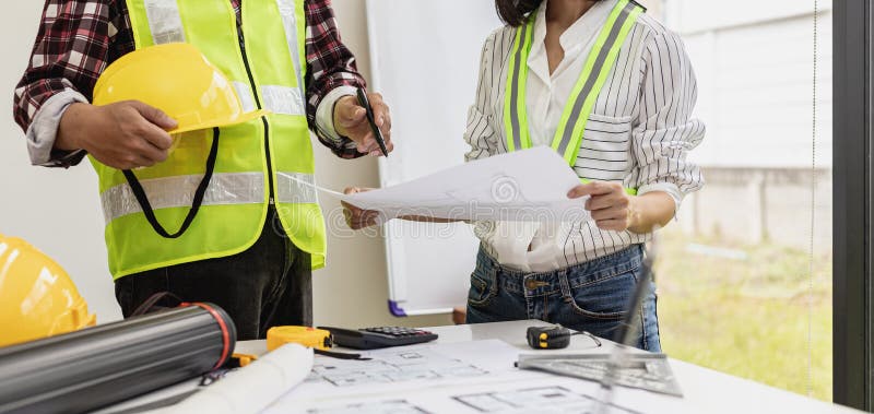 Architect Engineers are Standing by To Look at the Blueprints of the ...