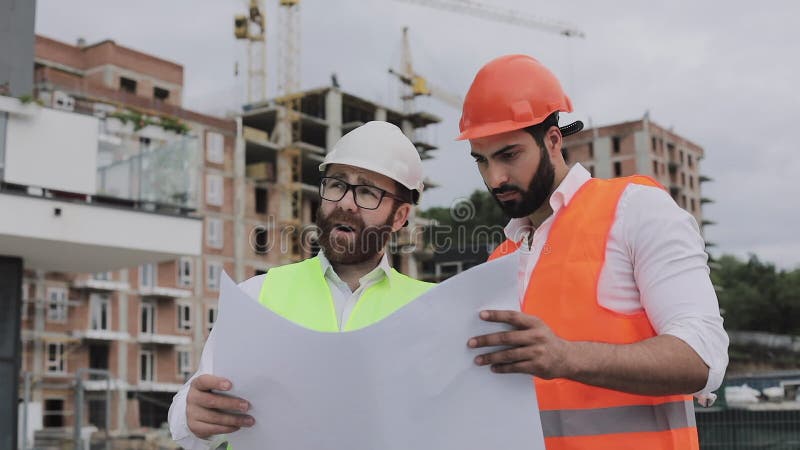 Architect Expert Engineers Talking and Analyze Design Plan Standing ...